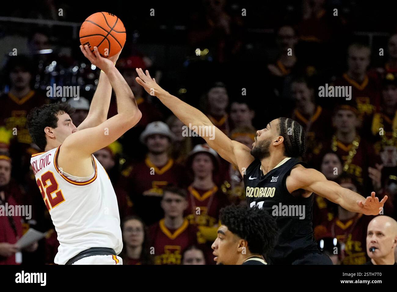 Iowa State forward Milan Momcilovic (22) shoots over Colorado guard ...