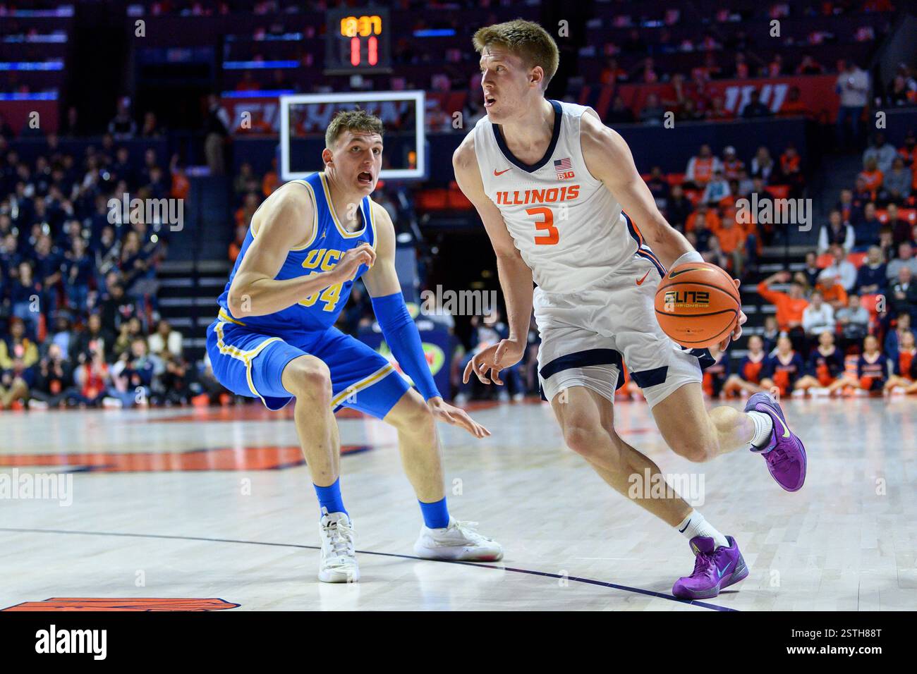 Illinois' Ben Humrichous drives past UCLA's Tyler Bilodeau during an ...