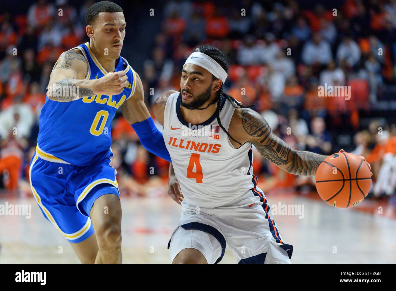 Illinois' Kylan Boswell drives as UCLA's Kobe Johnson defends during an ...