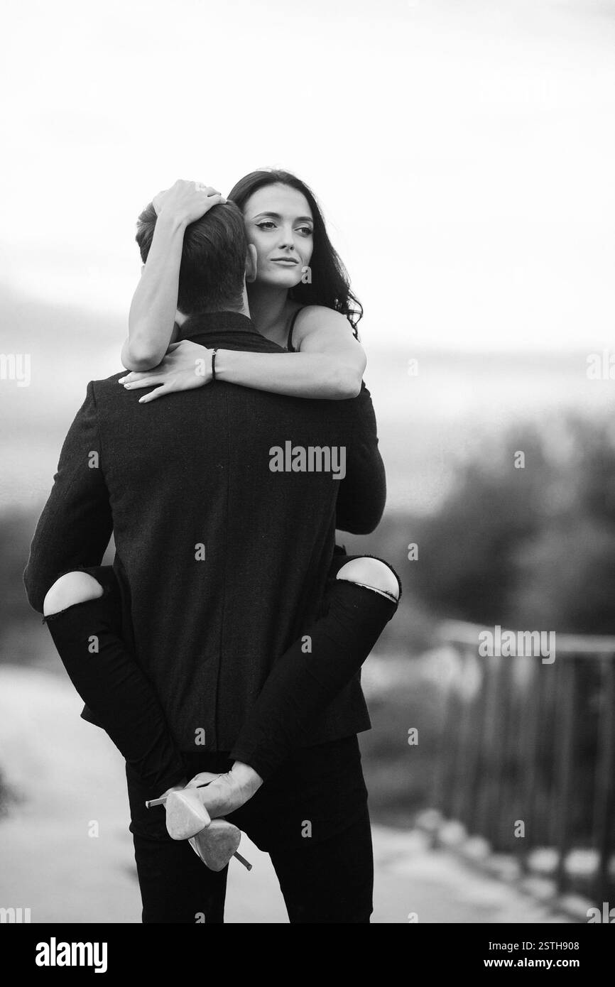 Young woman holding hair hands Black and White Stock Photos & Images ...