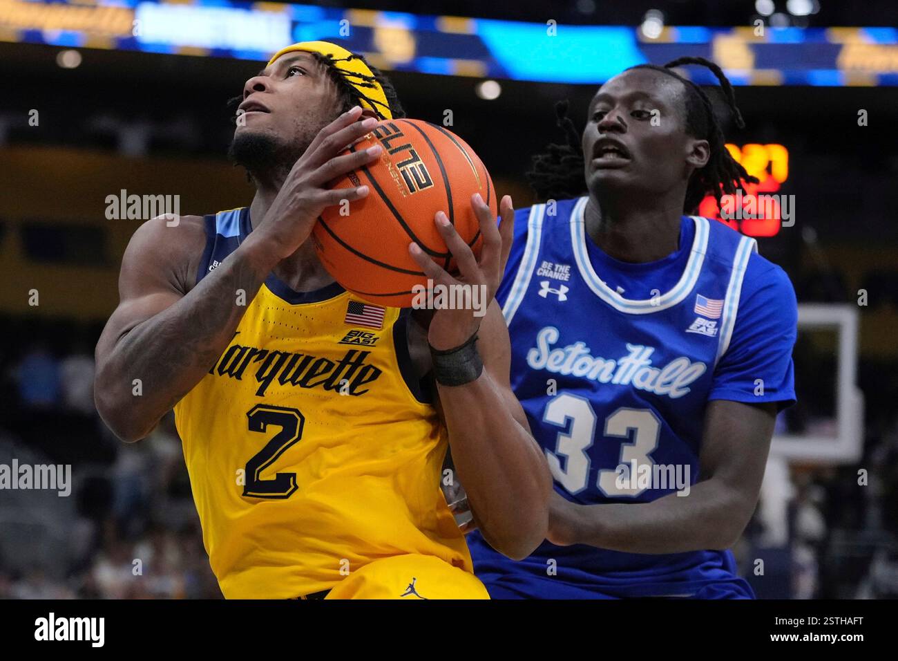 Marquette's Chase Ross gets past Seton Hall's Garwey Dual during the ...