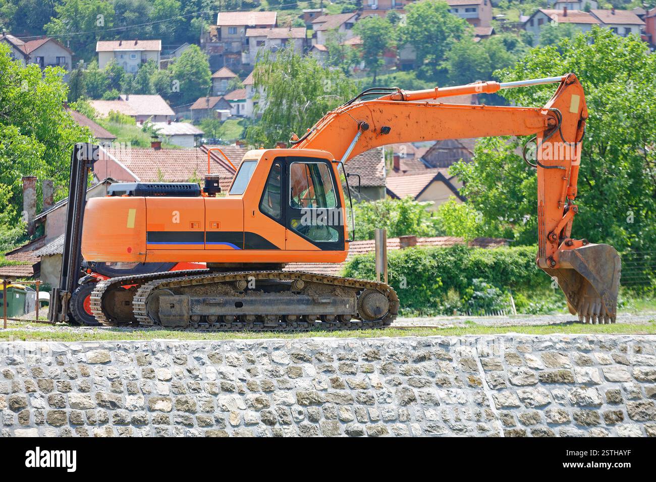 Digger excavator machine at canal construction site hi-res stock ...