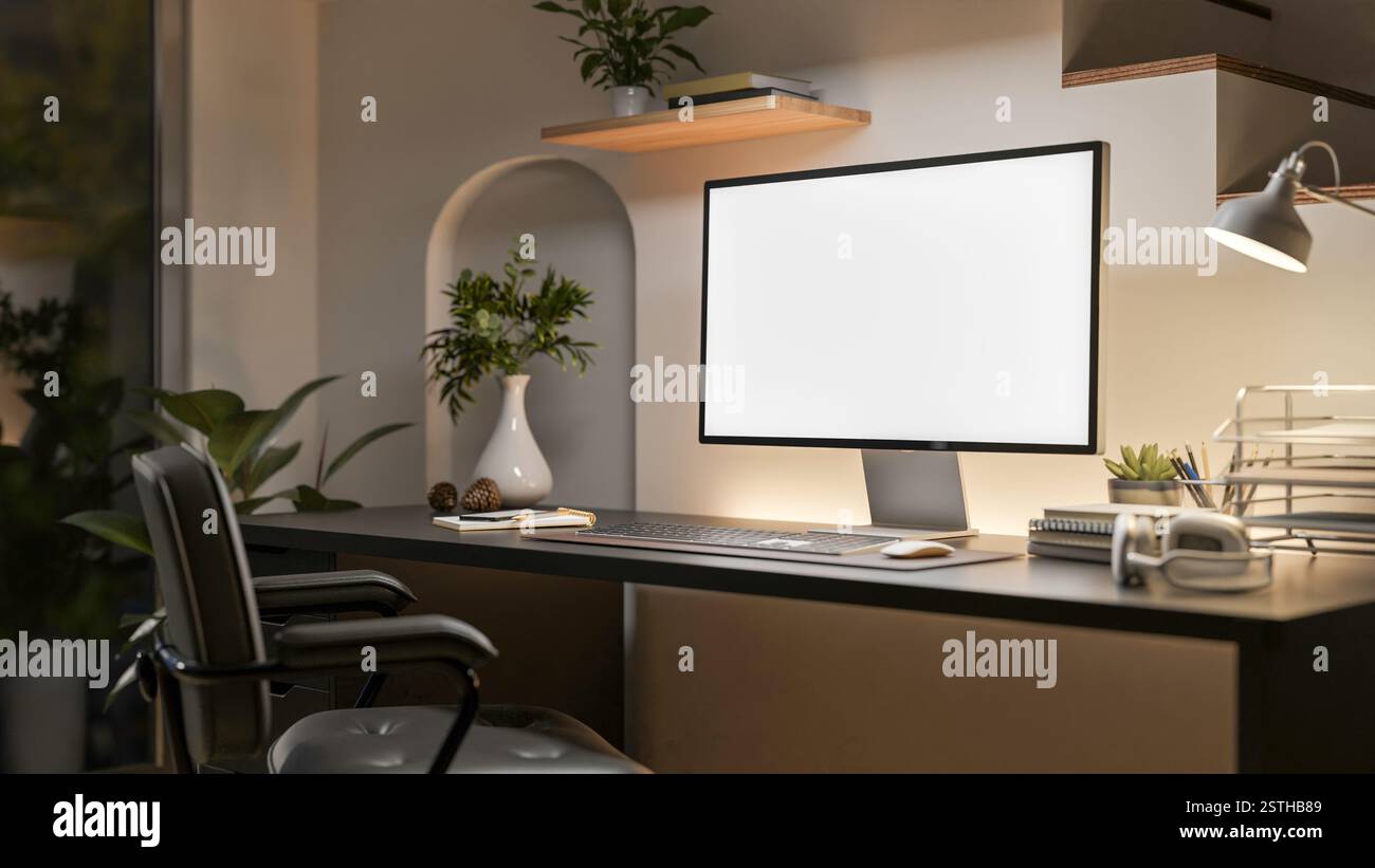 A cosy workspace with white screen computer and decorative item on the ...
