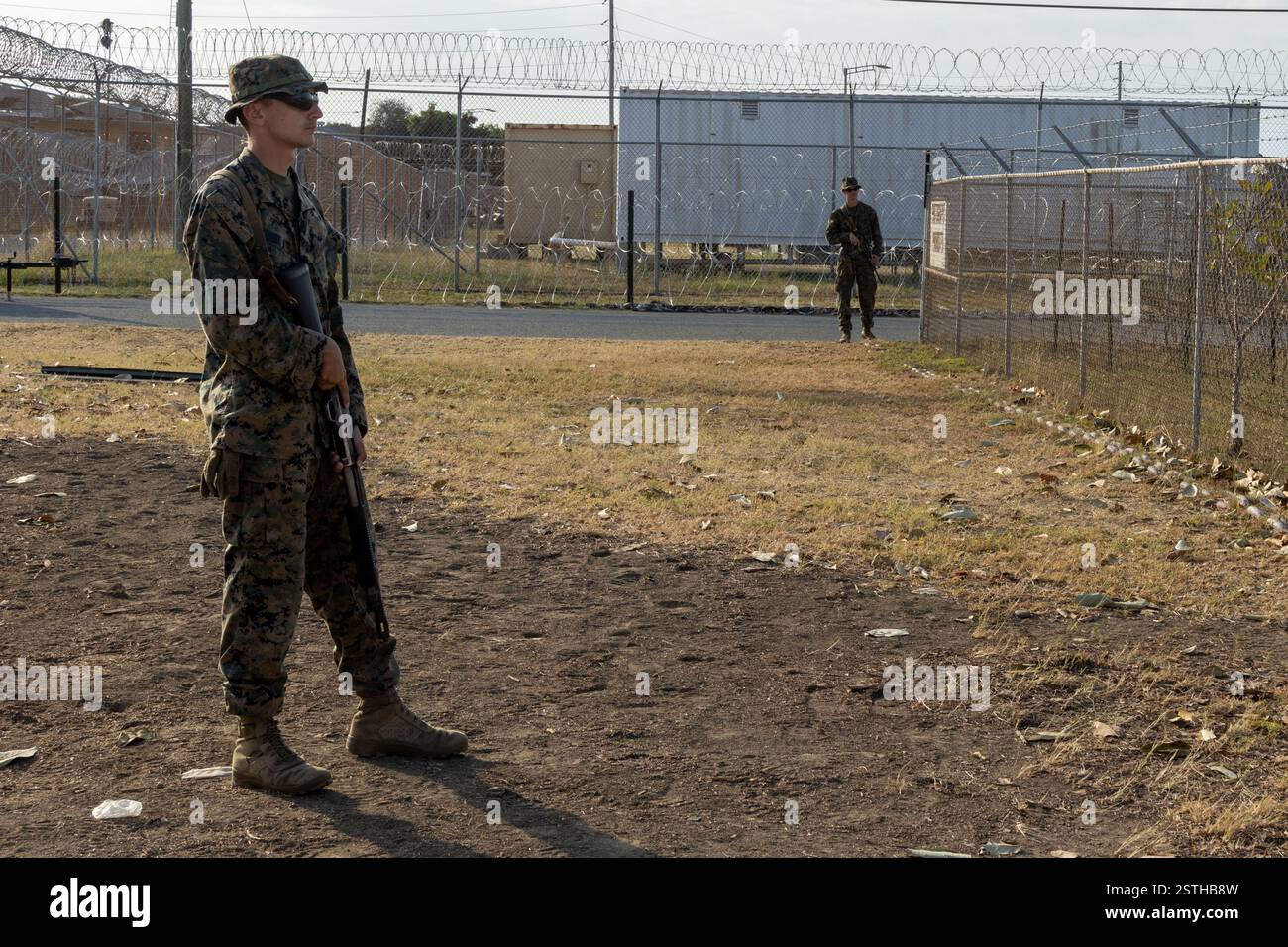 A U.S Marine provides security in support of interagency partners ...