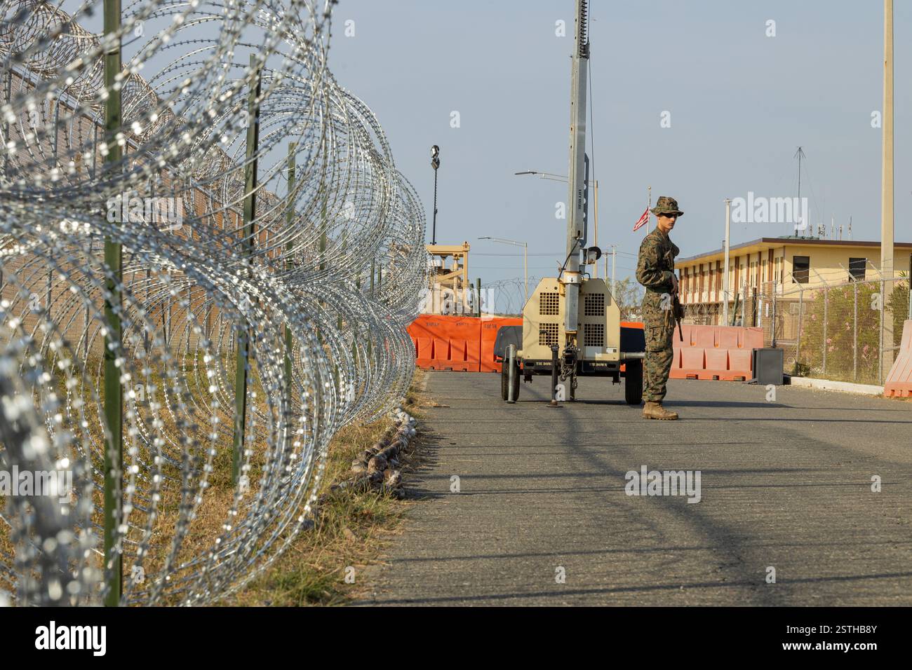 A U.S Marine provides security in support of interagency partners ...