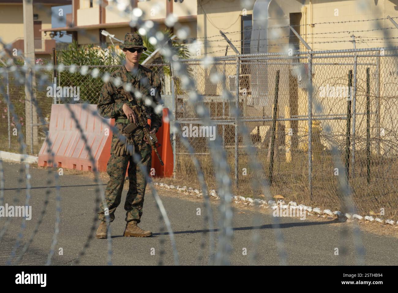 A U.S Marine provides security in support of interagency partners ...