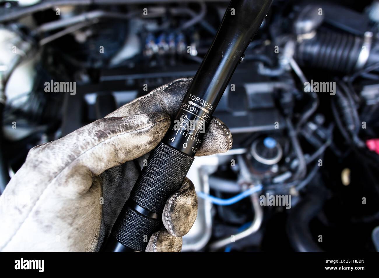 Close up a torque adjuster of torque wrench , mechanic holding torque ...