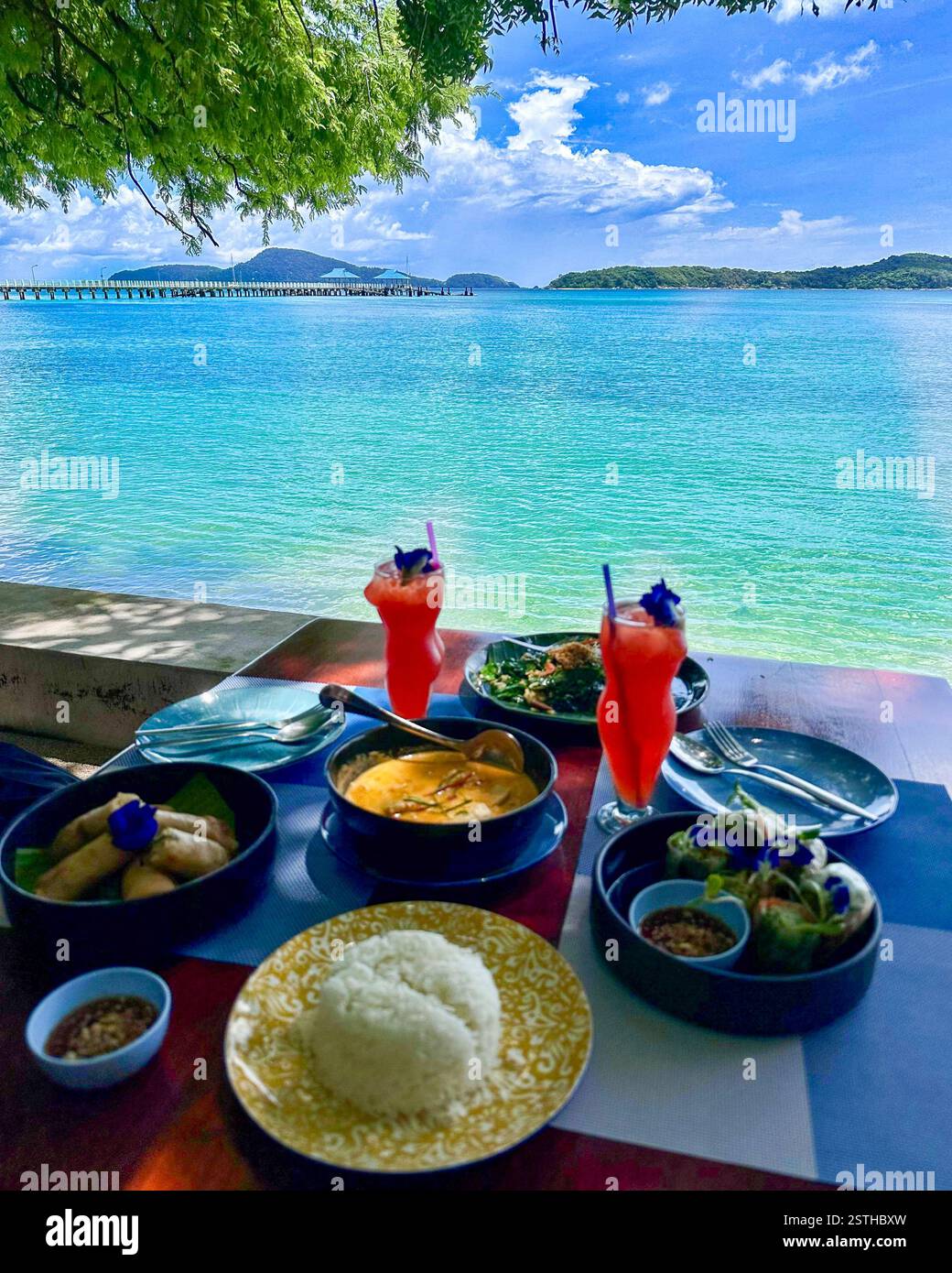 Seaside Dining with a Paradise View A shaded table facing turquoise ...