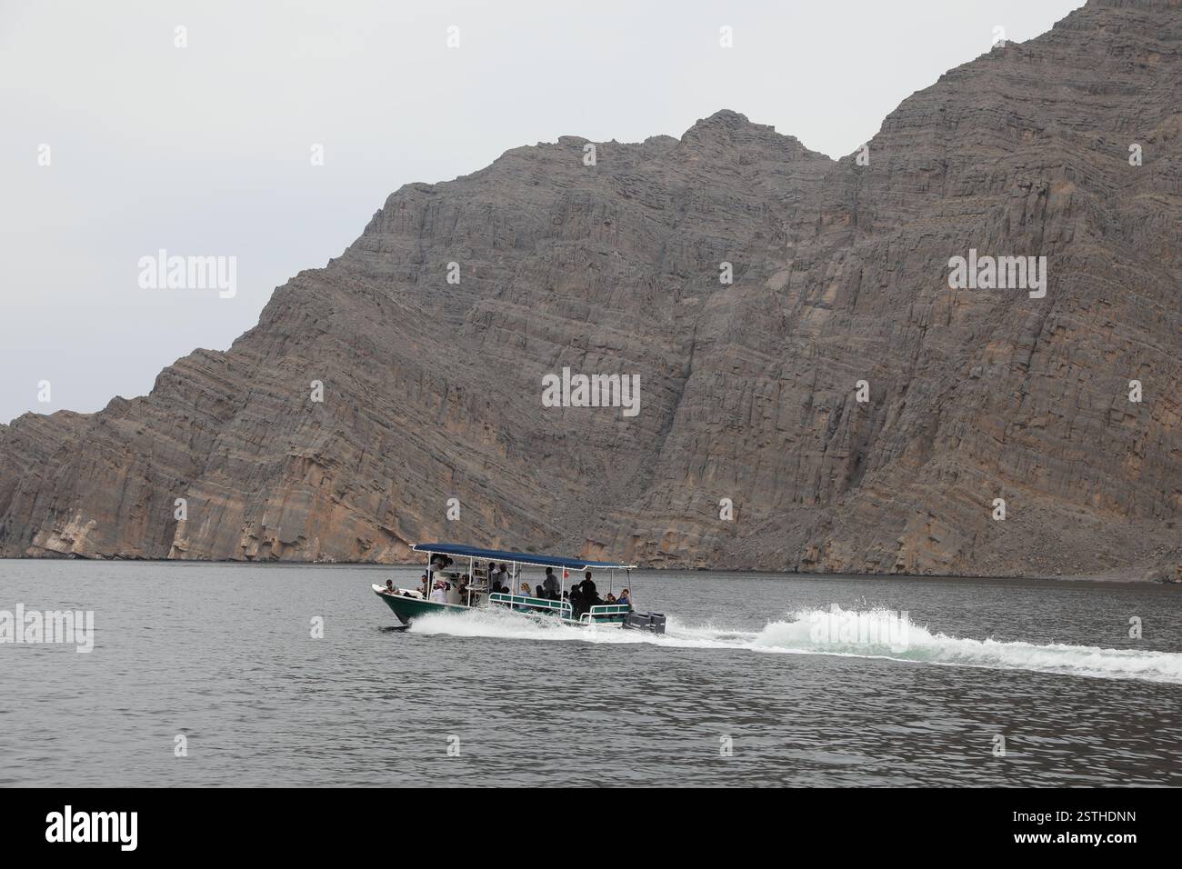 Musandam. 18th Feb, 2025. Tourists take a boat to enjoy the scenery of ...