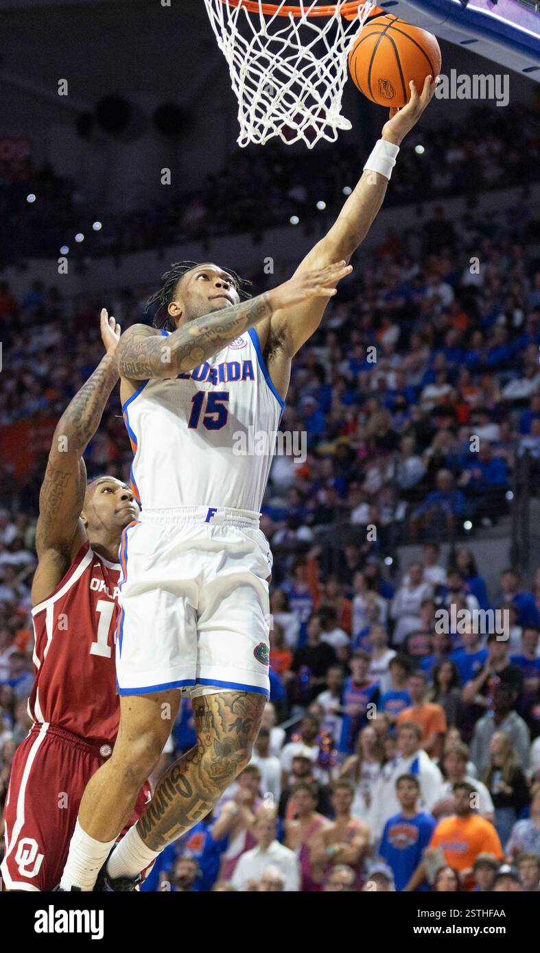 Florida guard Alijah Martin shoots past Oklahoma forward Jalon Moore ...