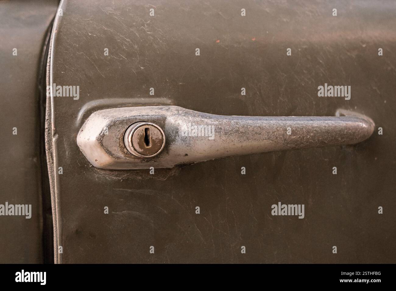 Door handle of old car deep military green color Stock Photo - Alamy