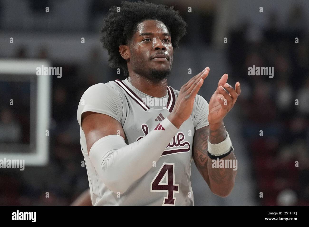 Mississippi State forward Cameron Matthews applauds his team as they ...