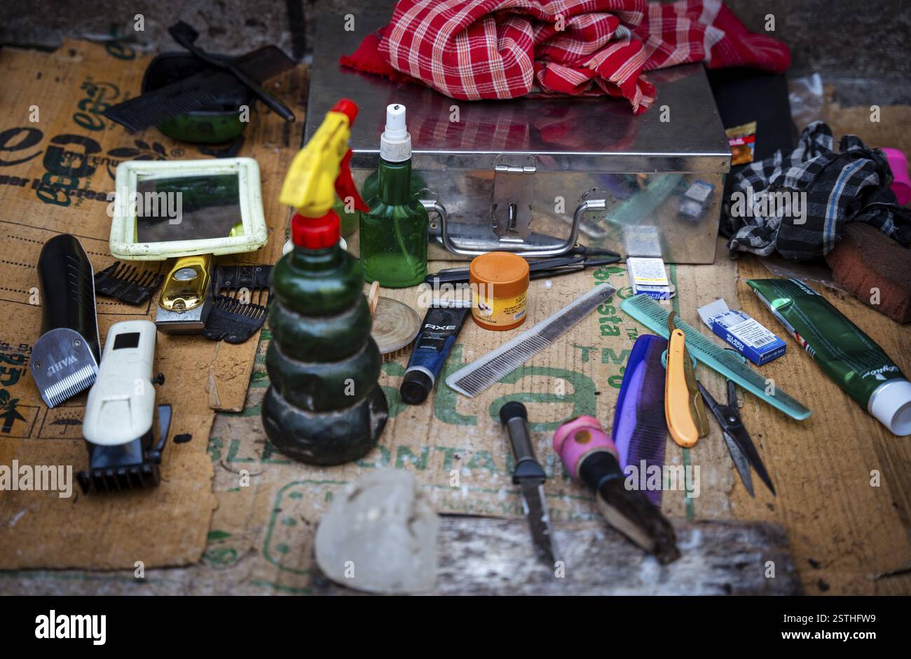 Shaving tools spread in a street barber shop in Guwahati, India on 1 ...