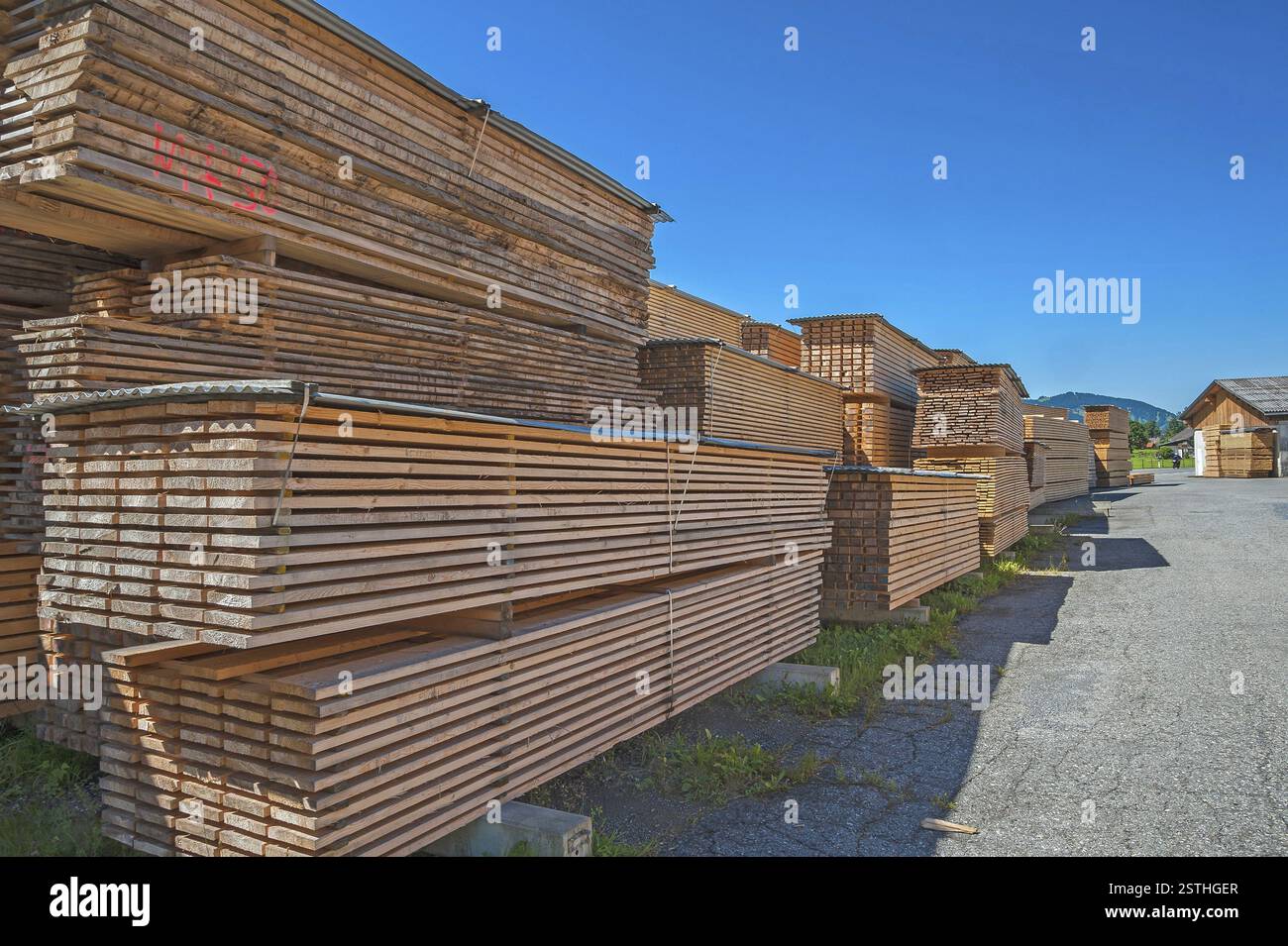 Stacked wooden slats, beams and boards in a sawmill near Hittisau ...