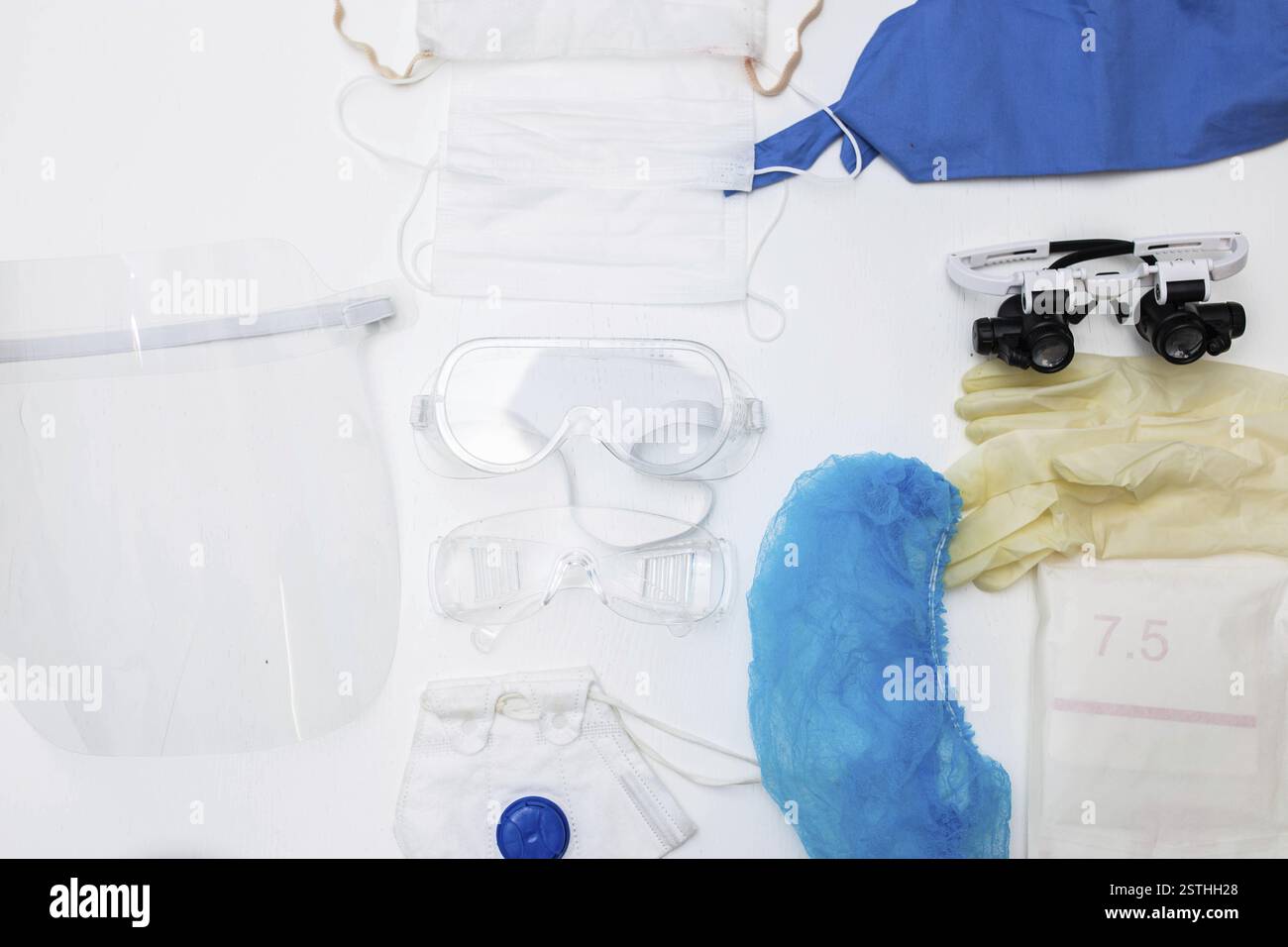 Assortment of medical protective gear including masks and goggles on a ...