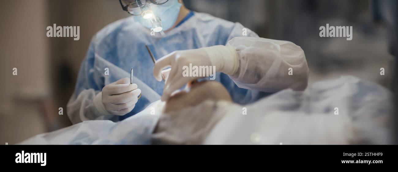 Surgeon performing medical procedure in hi-res stock photography and ...
