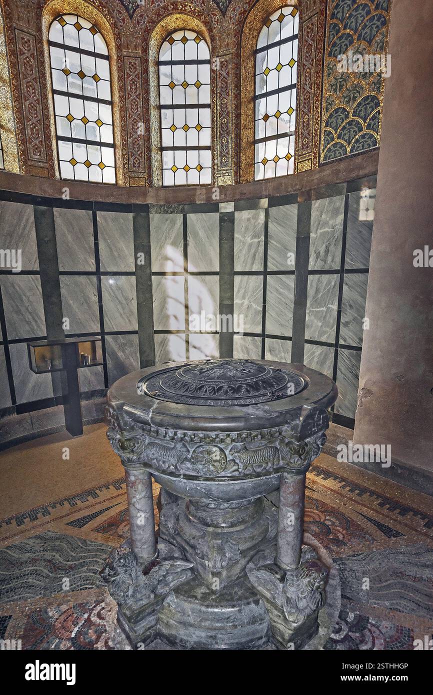 The baptismal font and arched window, St Benno's parish church, neo ...