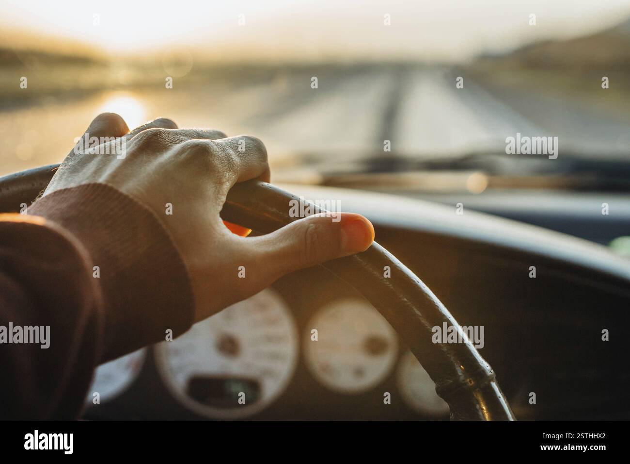 Driving car sun set hands hi-res stock photography and images - Alamy