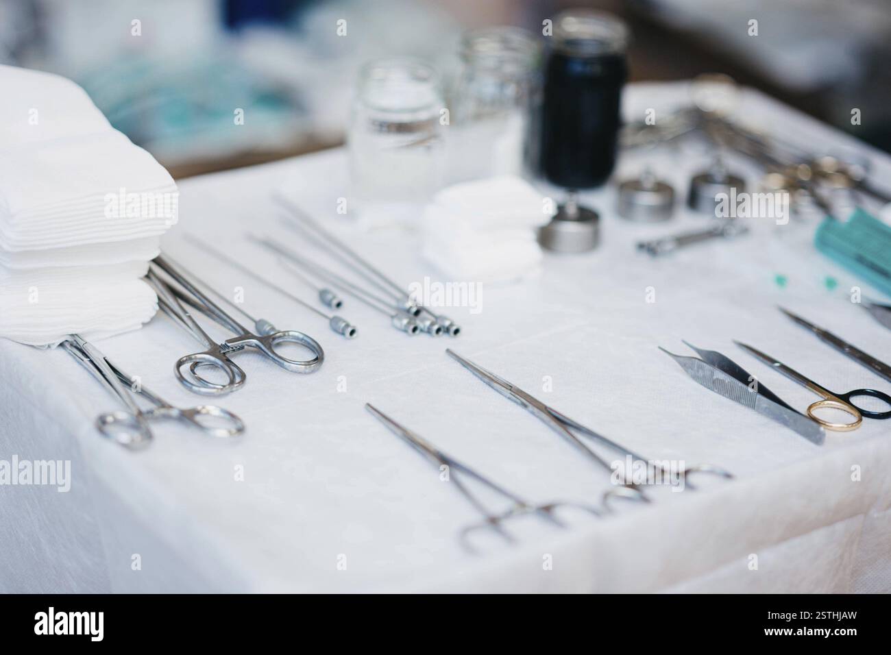 Close-up of surgical instruments placed on a sterile table ready for ...