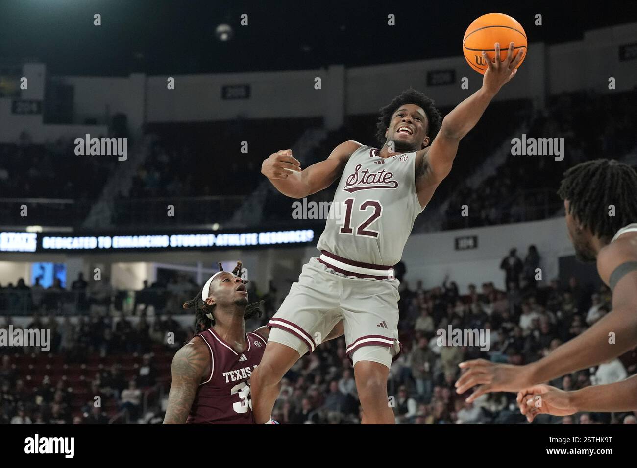 Mississippi State guard Josh Hubbard (12) attempts a layup past Texas A ...
