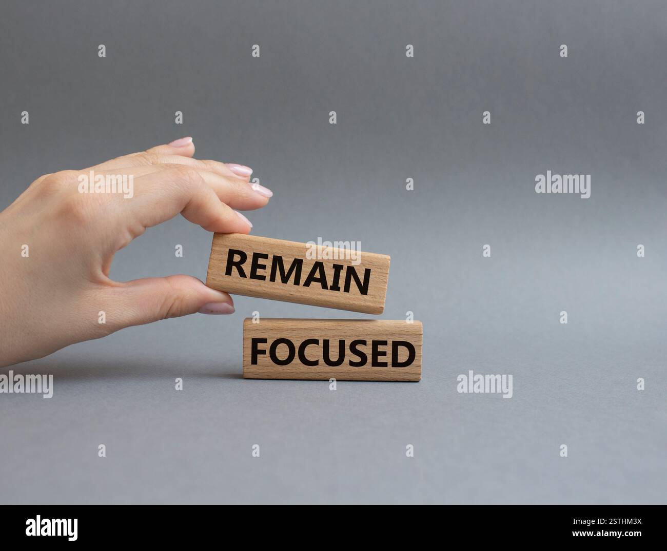 Remain focused symbol. Concept words Remain focused on wooden blocks ...