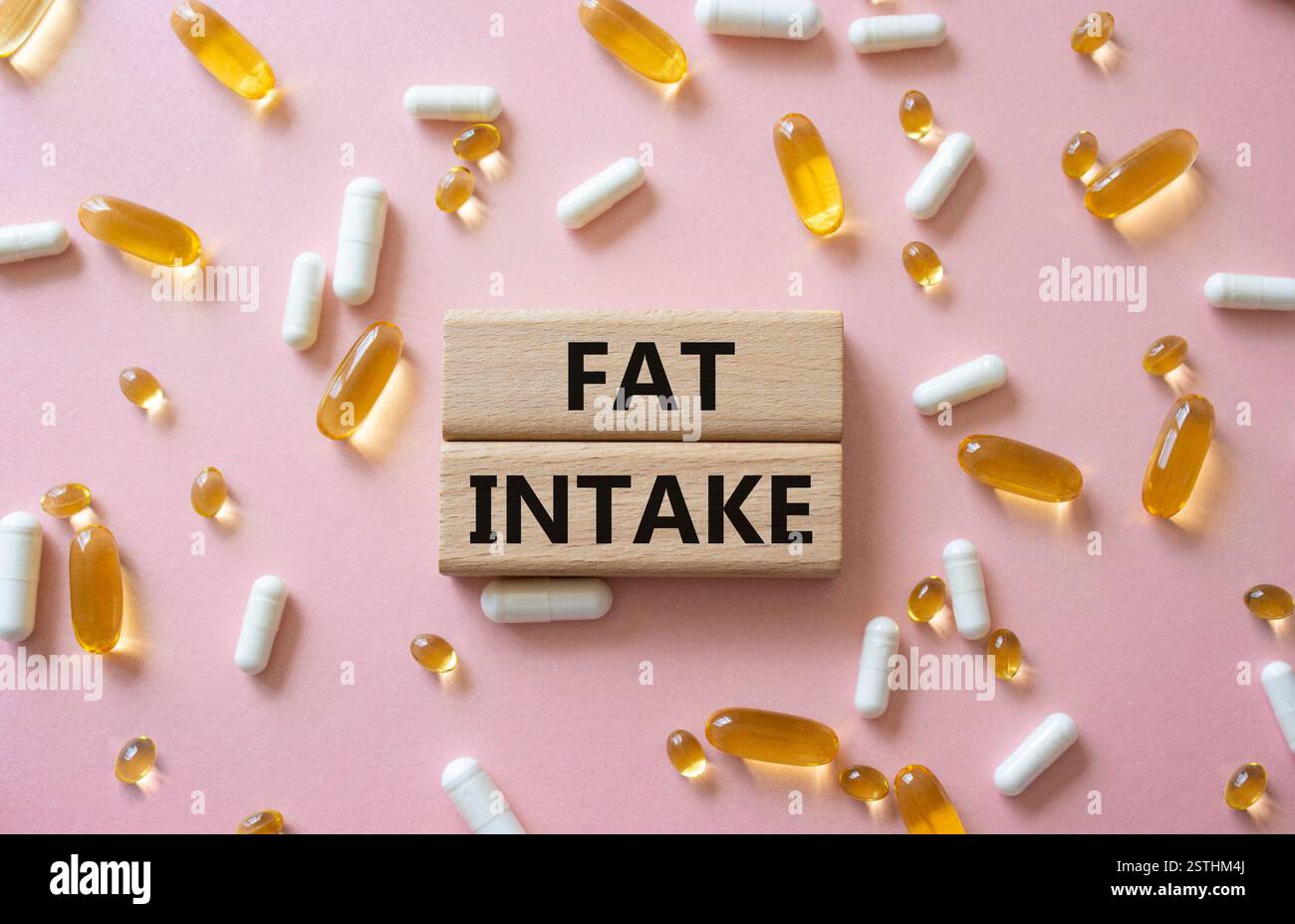 Fat Intake symbol. Concept word Fat Intake on wooden blocks. Beautiful ...