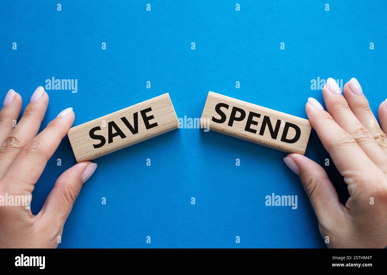 Save or Spend symbol. Concept word Save or Spend on wooden blocks ...