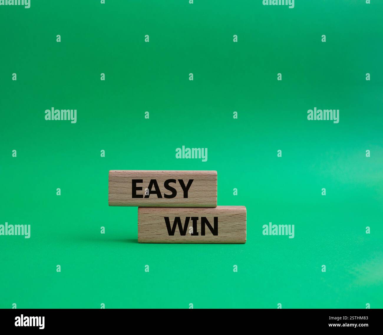 Easy win symbol. Wooden blocks with words 'Easy win'. Beautiful green ...