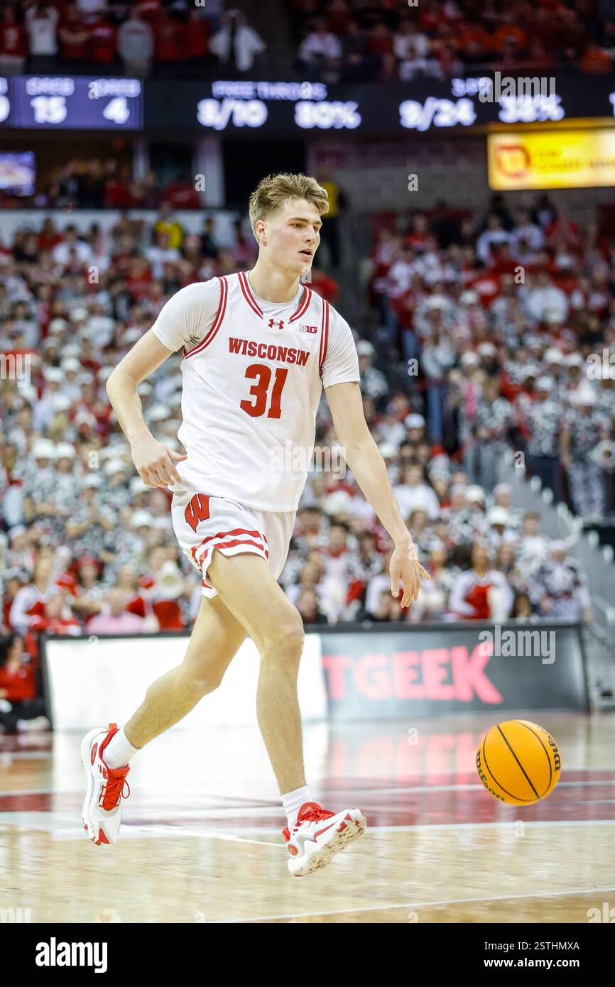 MADISON, WI - FEBRUARY 18: Wisconsin forward Nolan Winter (31) brings ...