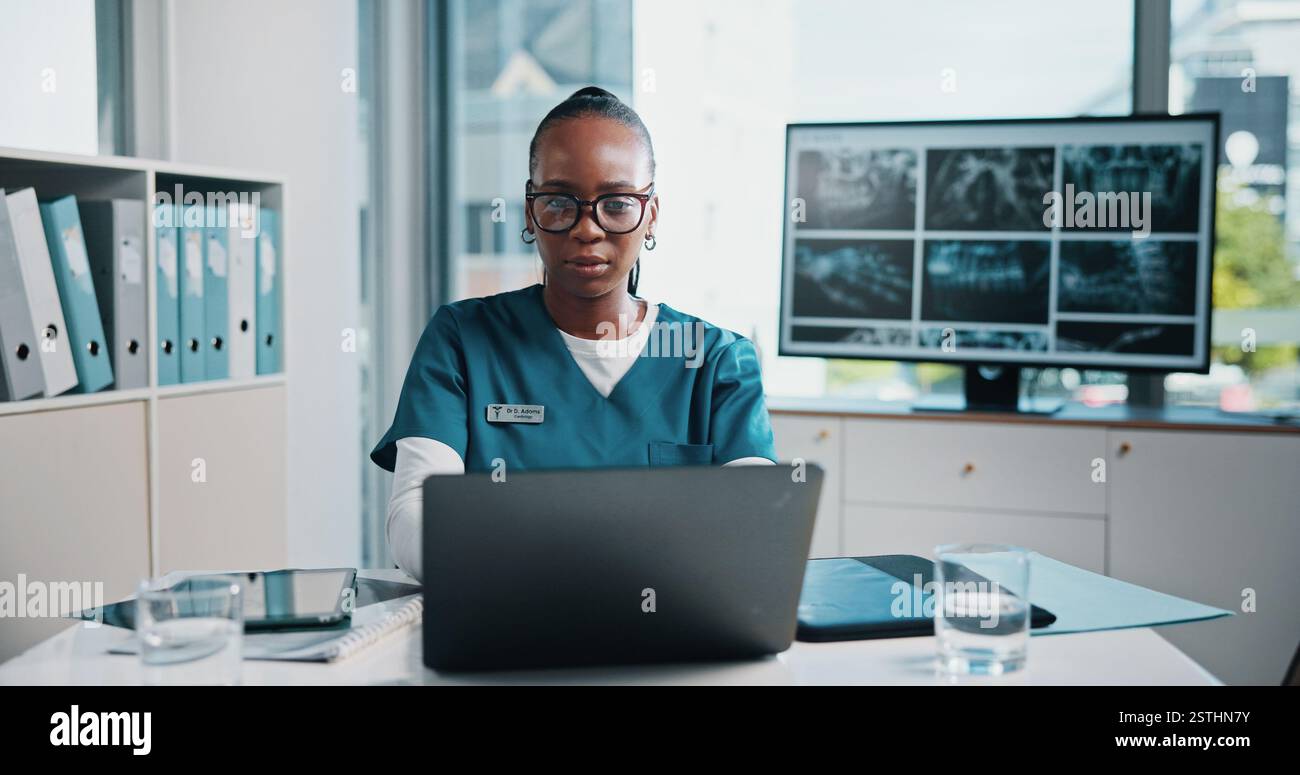 Black woman, doctor and check laptop at hospital of xray study, lab ...