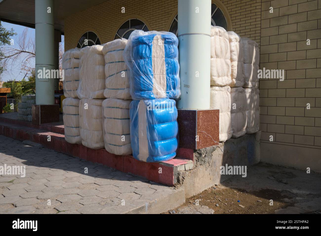 A business selling fresh bales of white, raw, processed cotton. In ...
