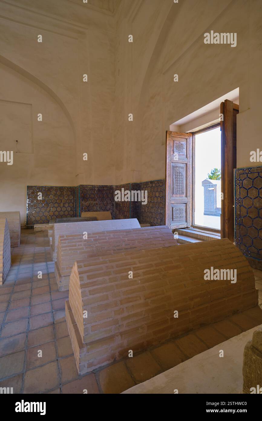 Interior view with simple, brick graves. At Ruhabad, Rukhobod Mausoleum ...