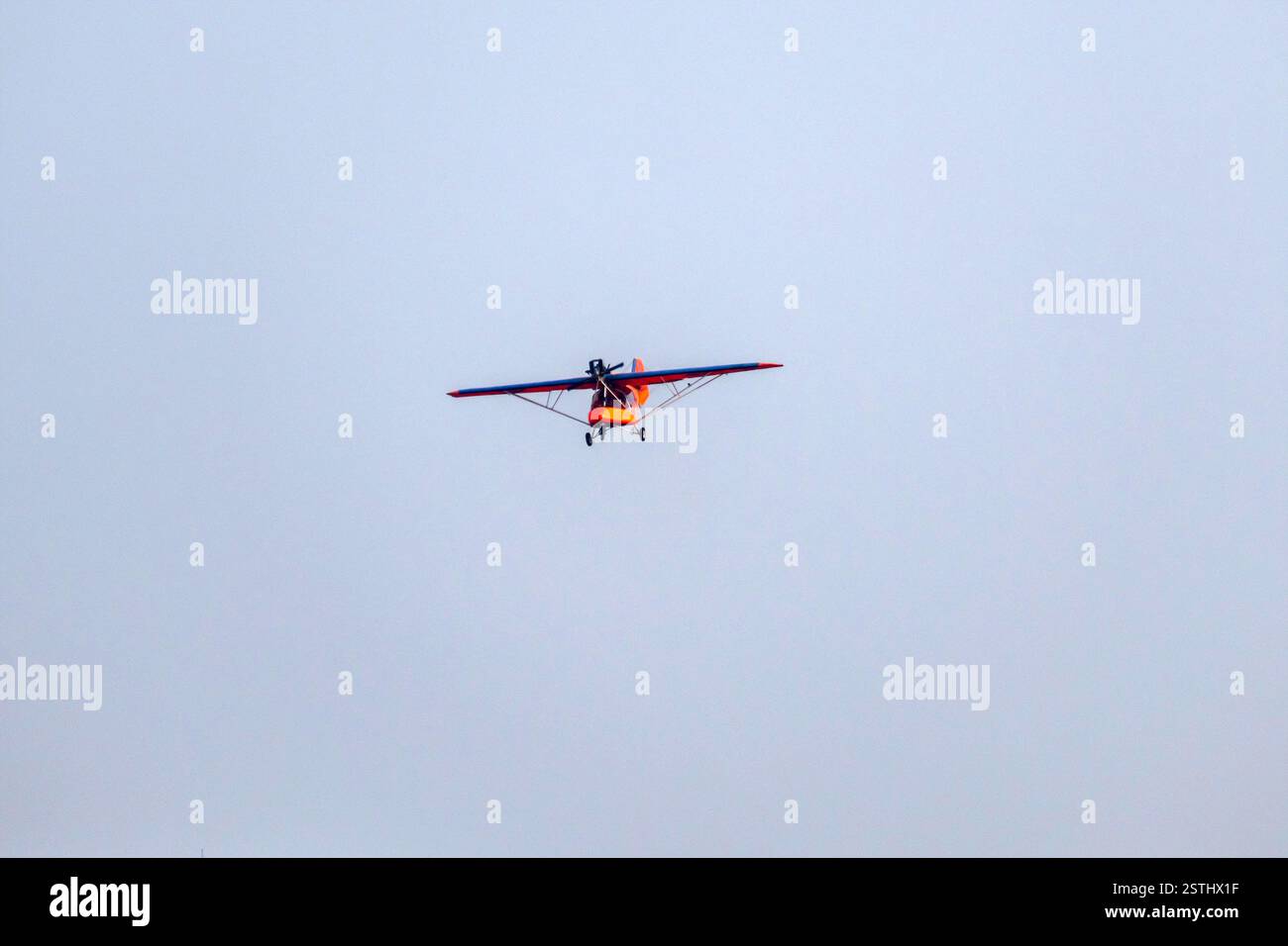 Classical Propeller airplane plane is flying on isolated blue sky in ...