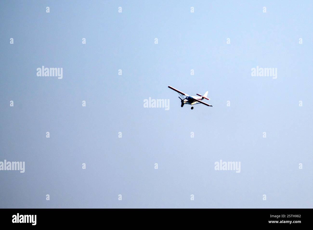 Classical Propeller airplane plane is flying on isolated blue sky in ...