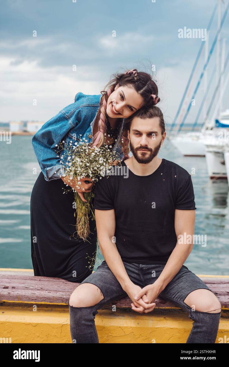 Guy and girl on pier Stock Photo - Alamy
