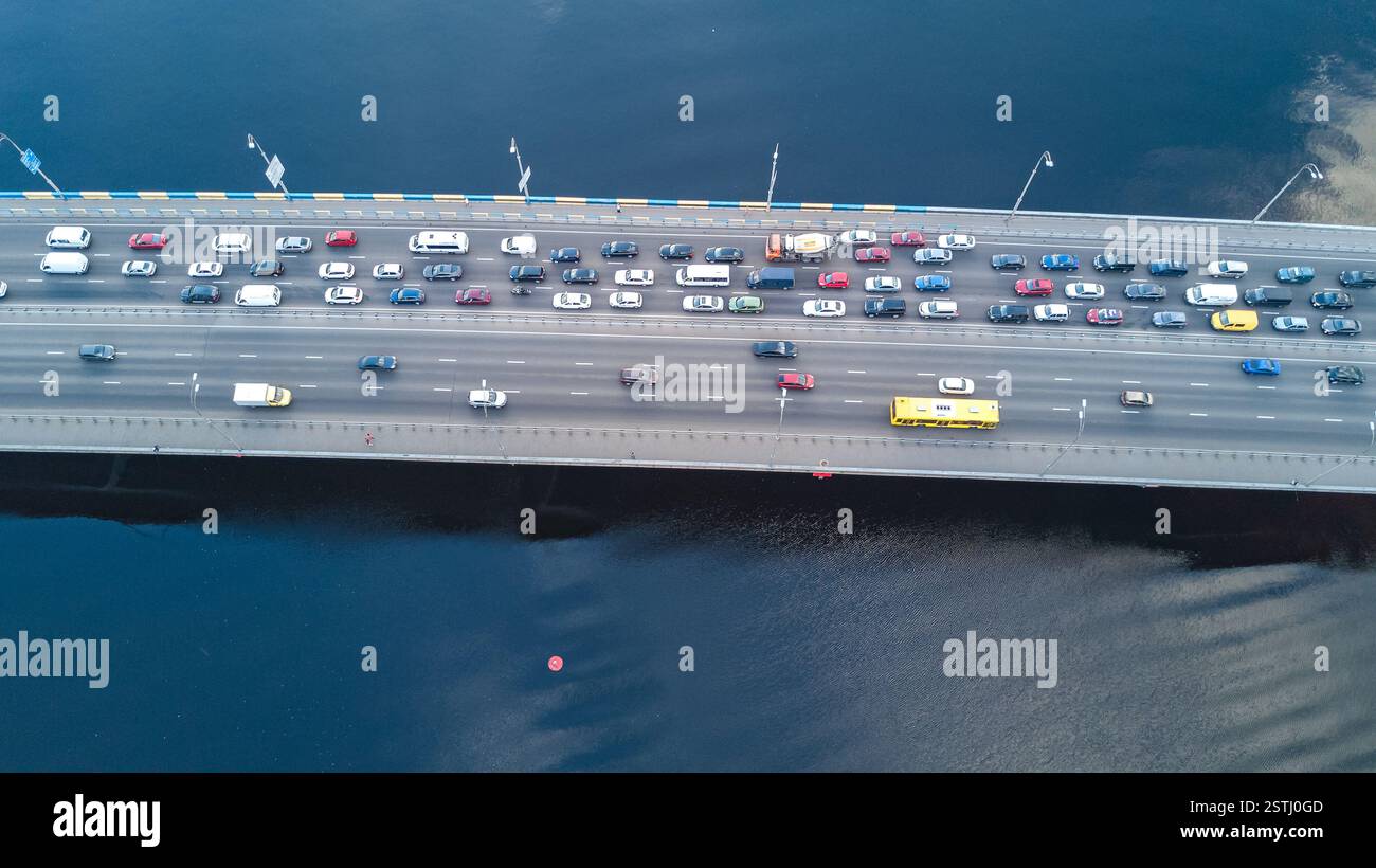 Aerial drone view of bridge road automobile traffic of many cars from ...