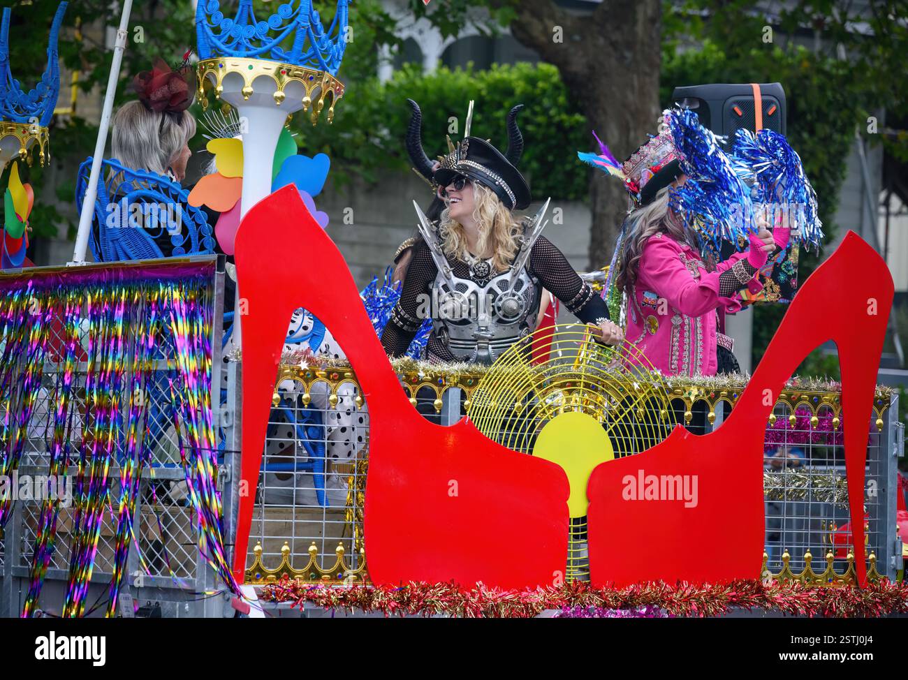 Auckland, New Zealand - Feb 15 2025: People with pirate costumes on a float with red platform ...
