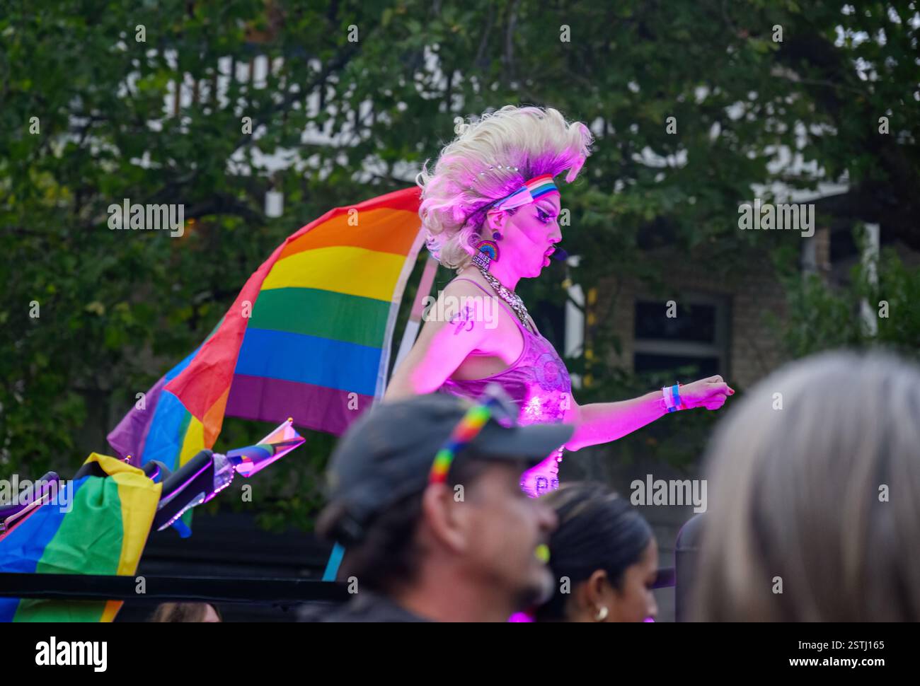Auckland, New Zealand - Feb 15 2025: People with fancy wig on a float ...
