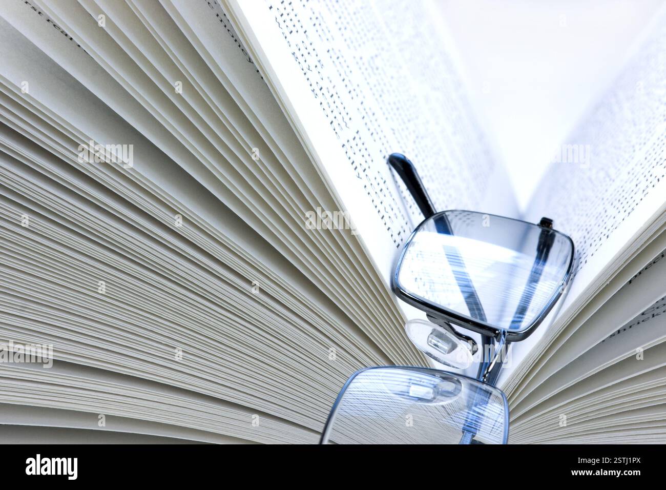 Open book with Spectacles Stock Photo - Alamy