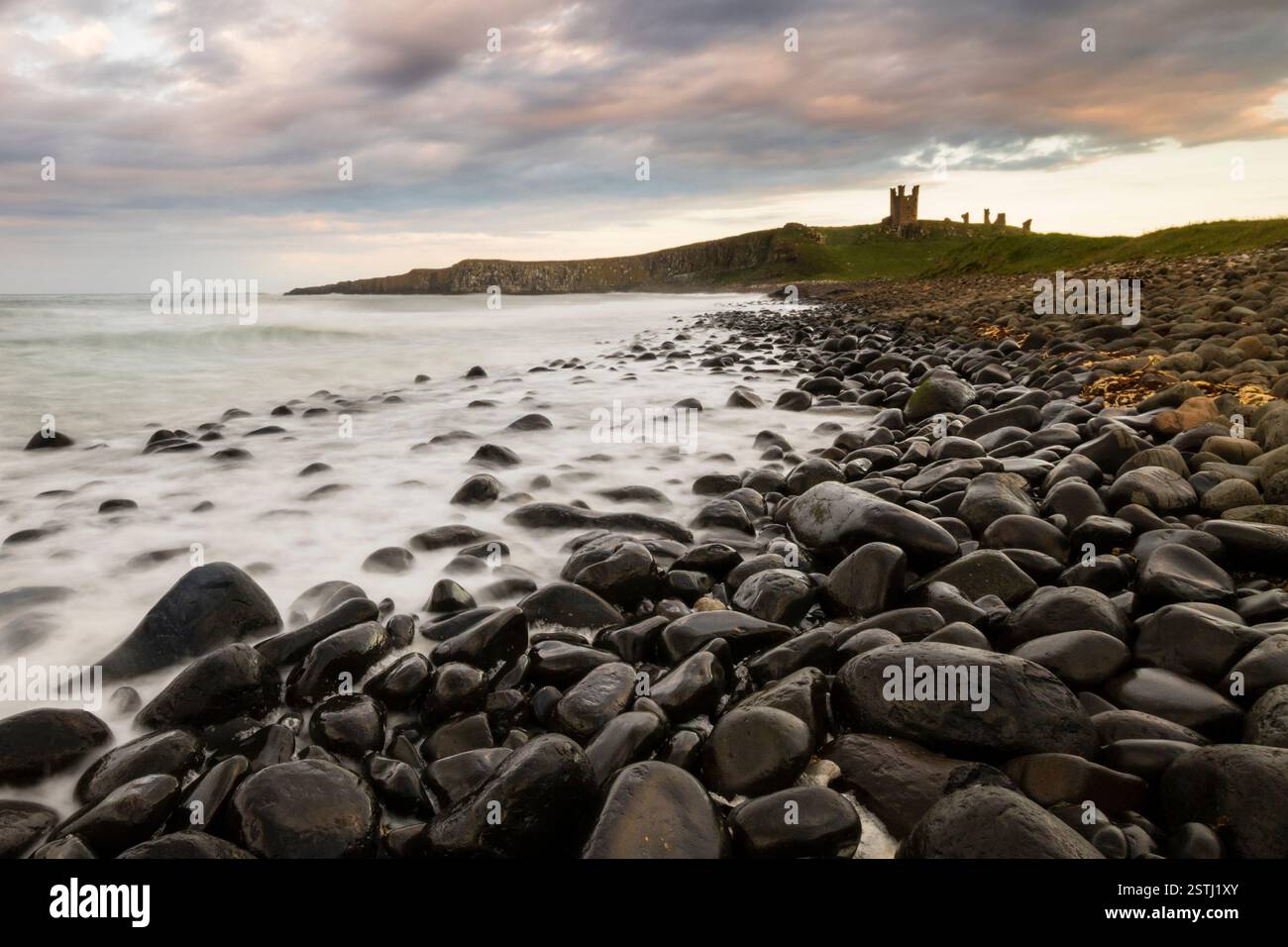Dunstanburgh Castle on the coast of Northumberland in northern England ...