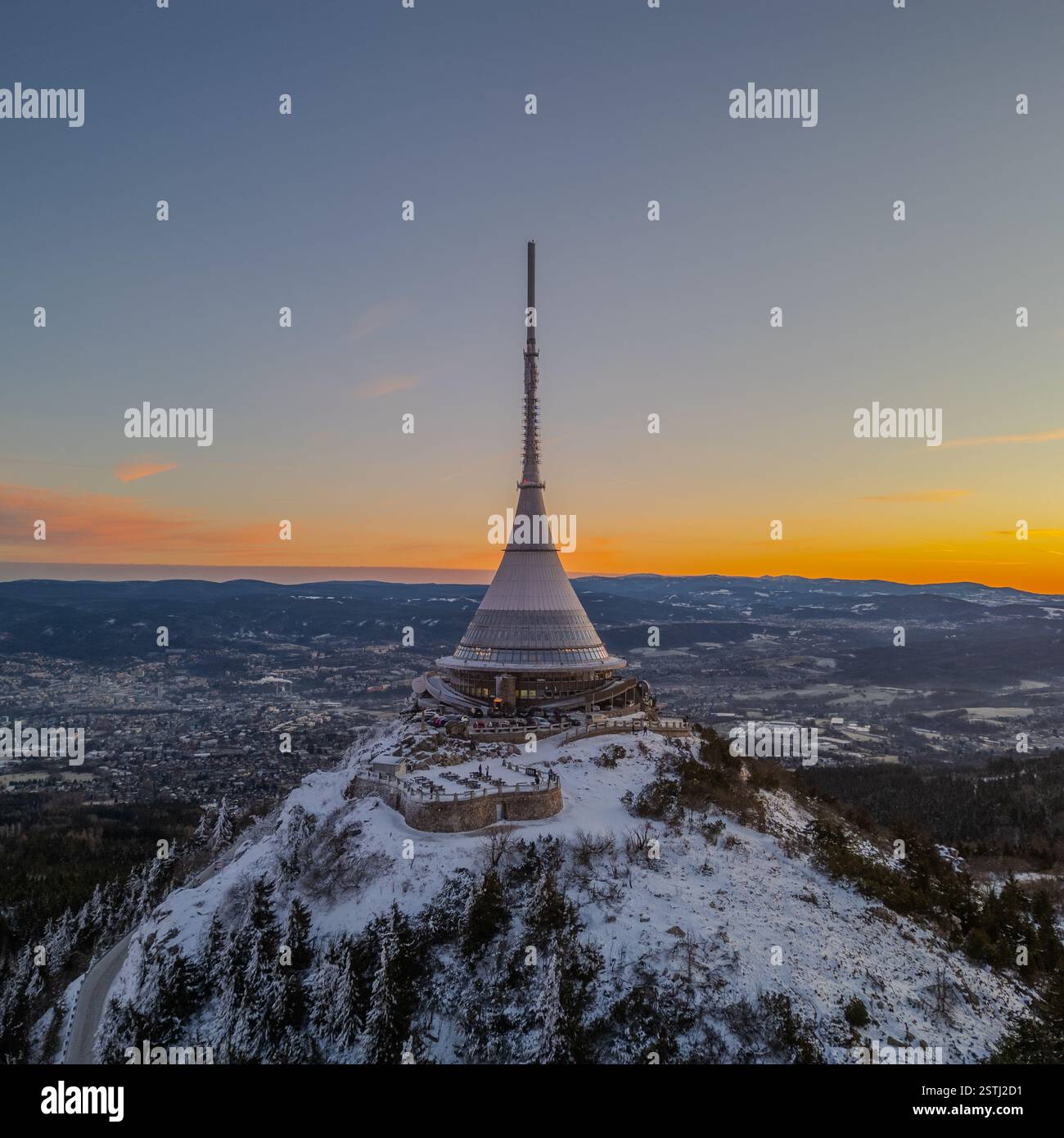 Jested Mountain stands majestically at dawn, with a blanket of snow ...