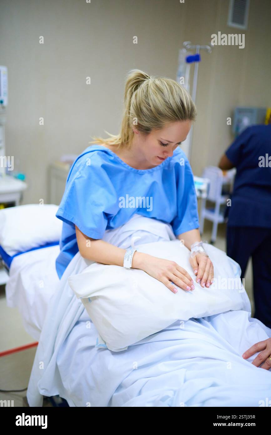 Hospital bed, pregnancy and woman waiting for consultation, wellness ...