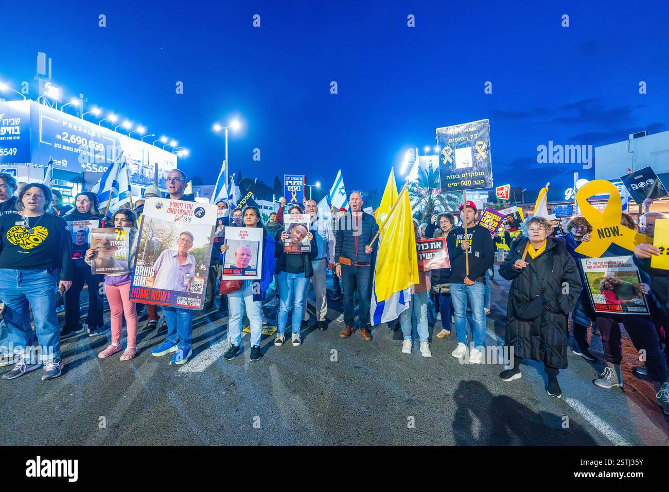 Haifa, Israel - February 17, 2025: Scene of people reading the hostages ...