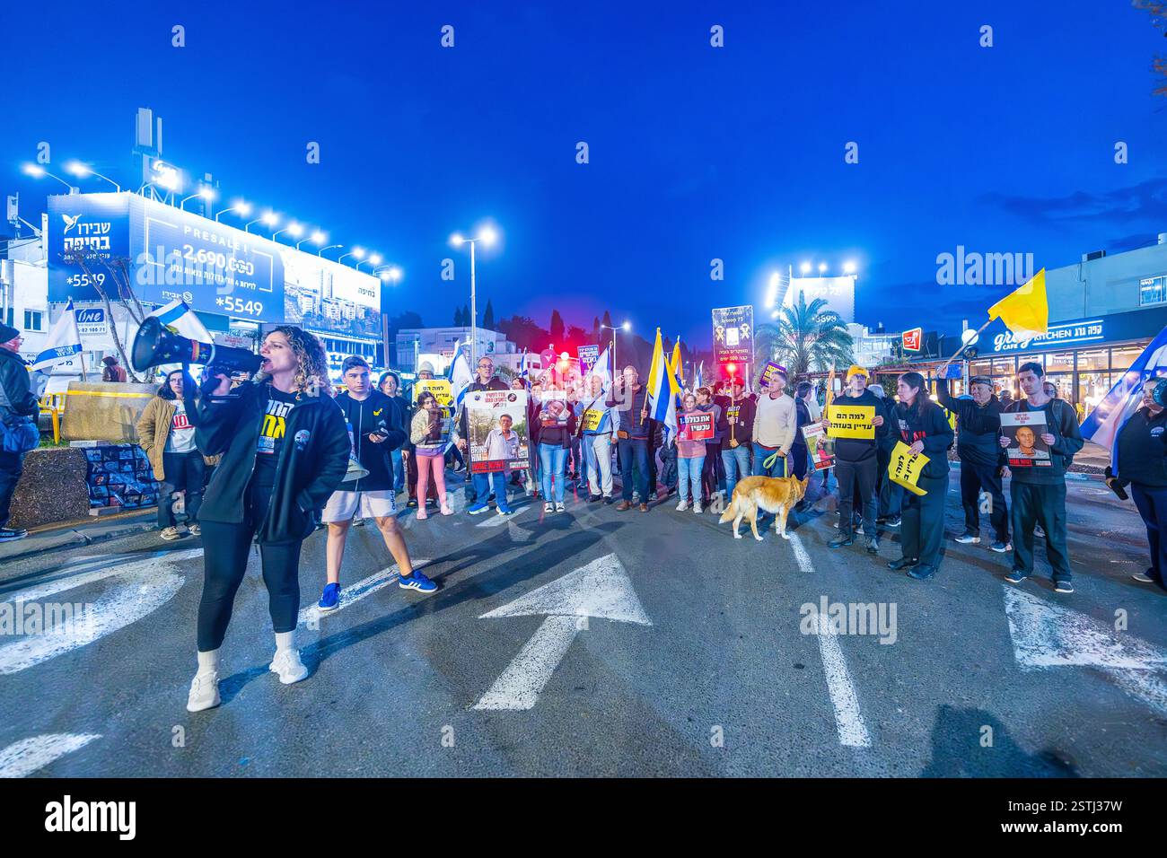 Haifa, Israel - February 17, 2025: Scene of people reading the hostages ...