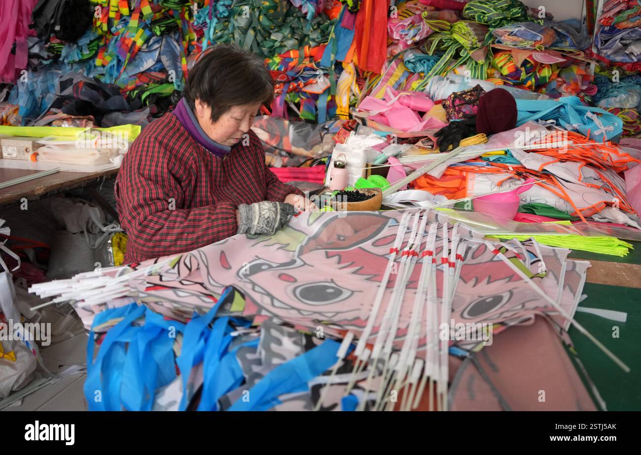 Weifang, China's Shandong Province. 18th Feb, 2025. A worker makes ...
