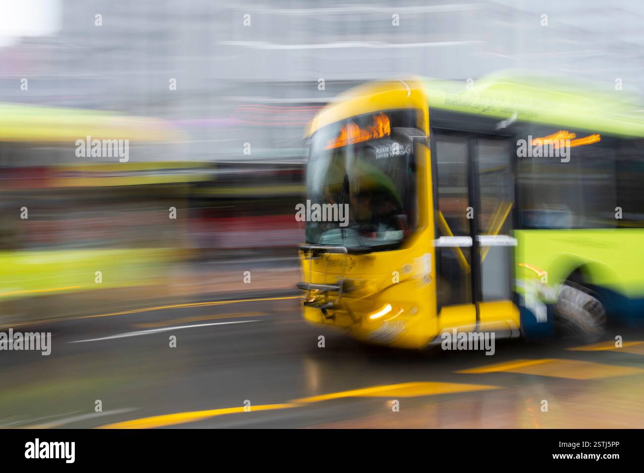 Buses speeding through Wellington, North Island, New Zealand Stock ...