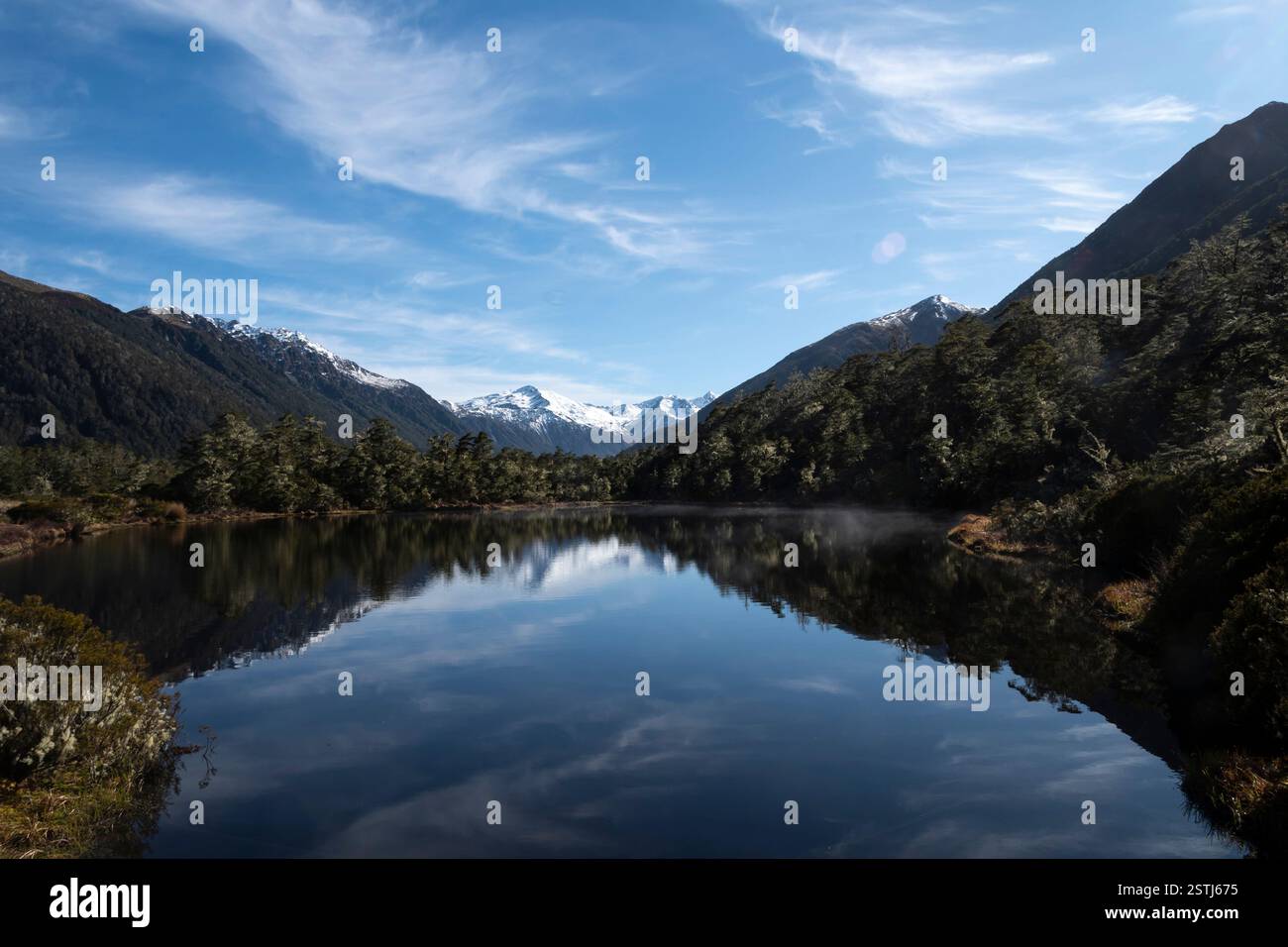 Tarn and snowy mountains, Lewis Pass, South Island, New Zealand Stock ...