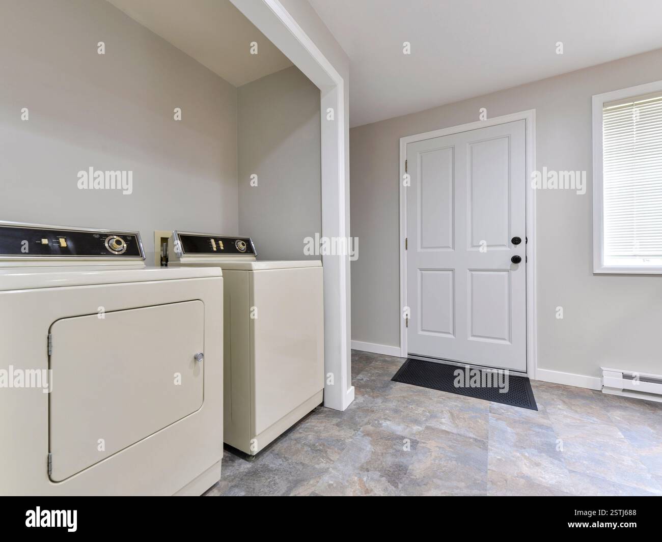 Modern residential laundry room interior Stock Photo - Alamy