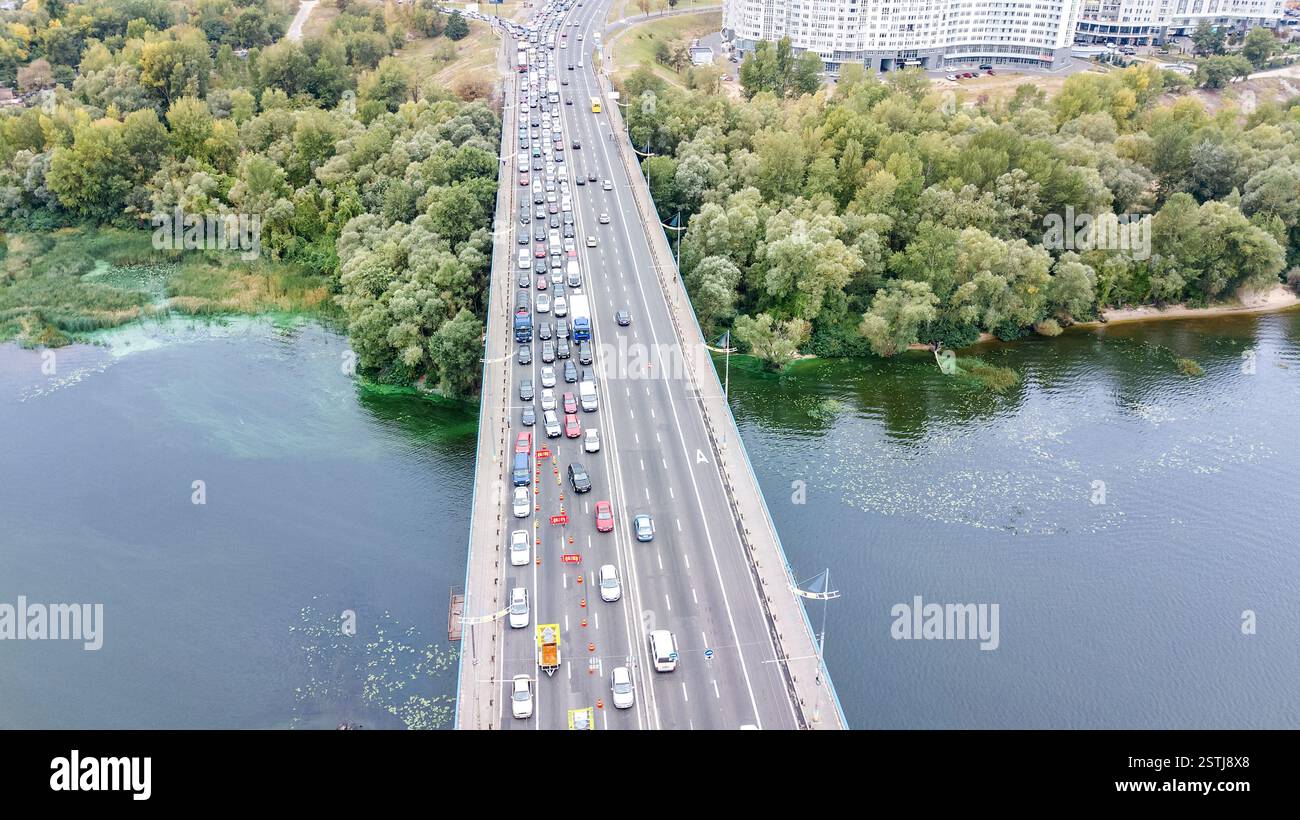 Aerial top view of bridge road automobile traffic jam of many cars from ...