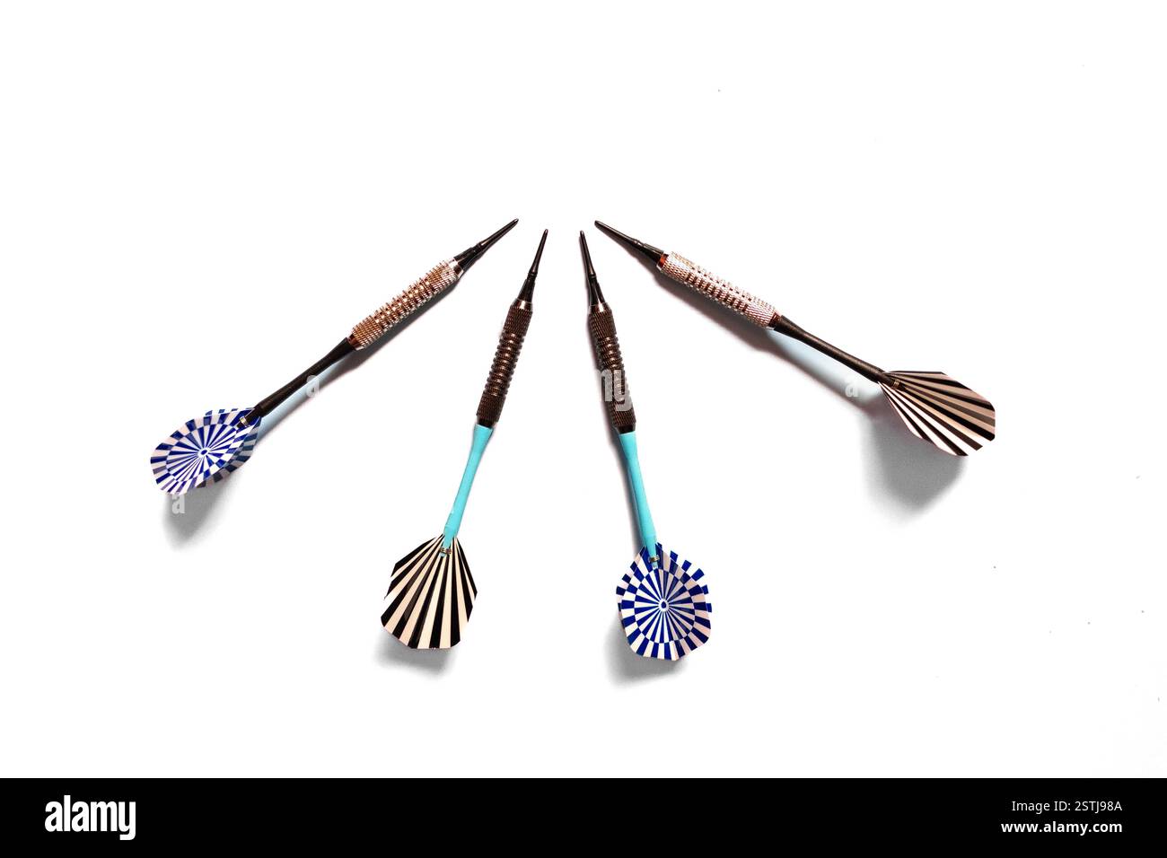 Four darts pointing to one point different directions on white ...